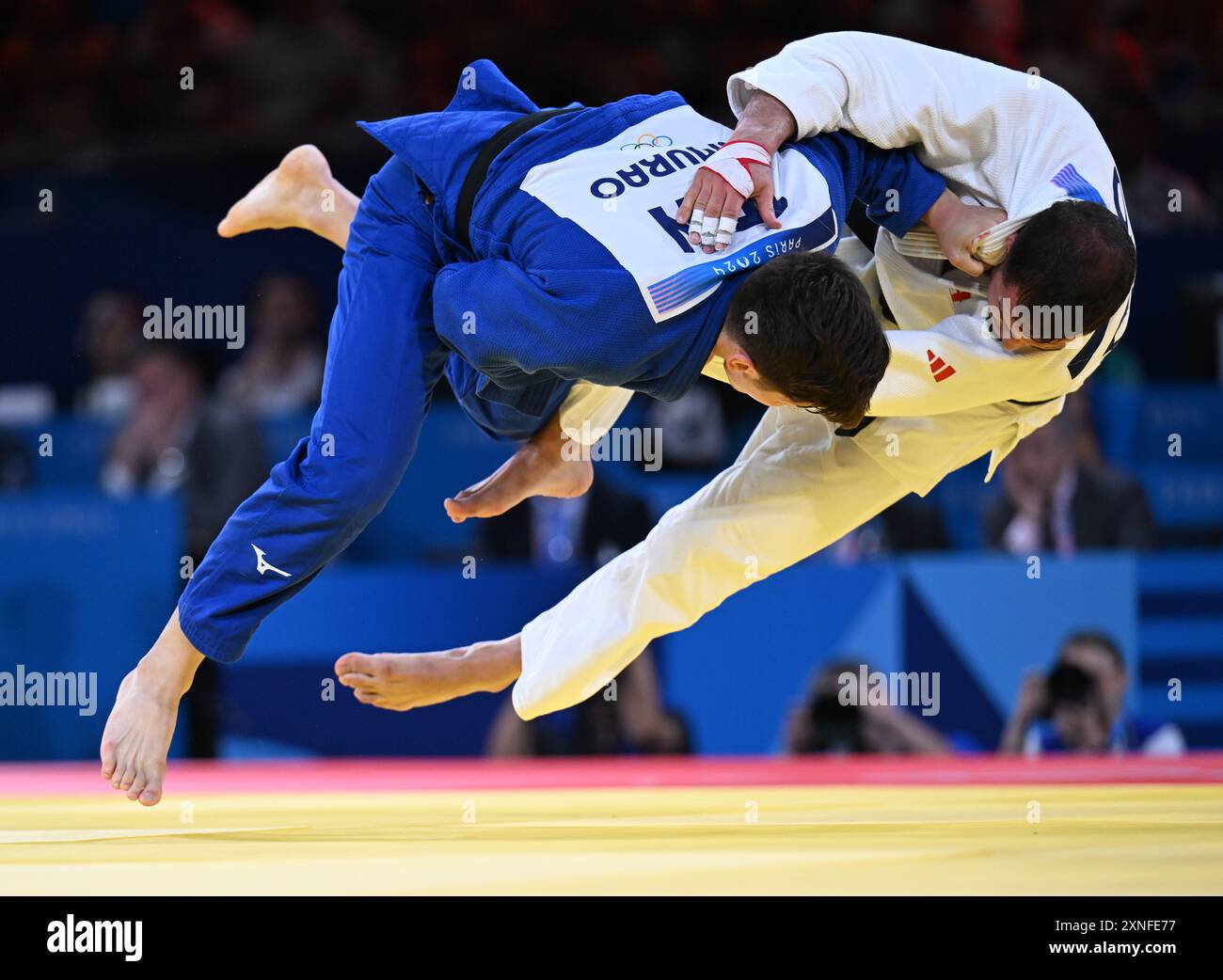 Paris, France. 31st July, 2024. Lasha Bekauri (white) of Georgia ...