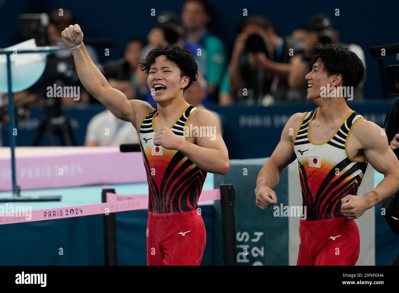 Shinnosuke Oka, left, and Daiki Hashimoto, of Japan, celebrate after Oka won the gold medal ...