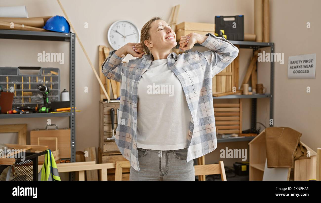 A contented young woman in casual attire smiles as she takes a break inside a well-organized ...