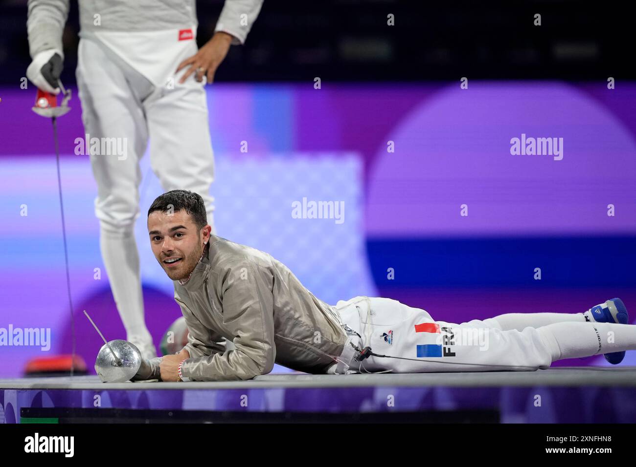 France's Sebastien Patrice celebrates after winning in the men's team ...