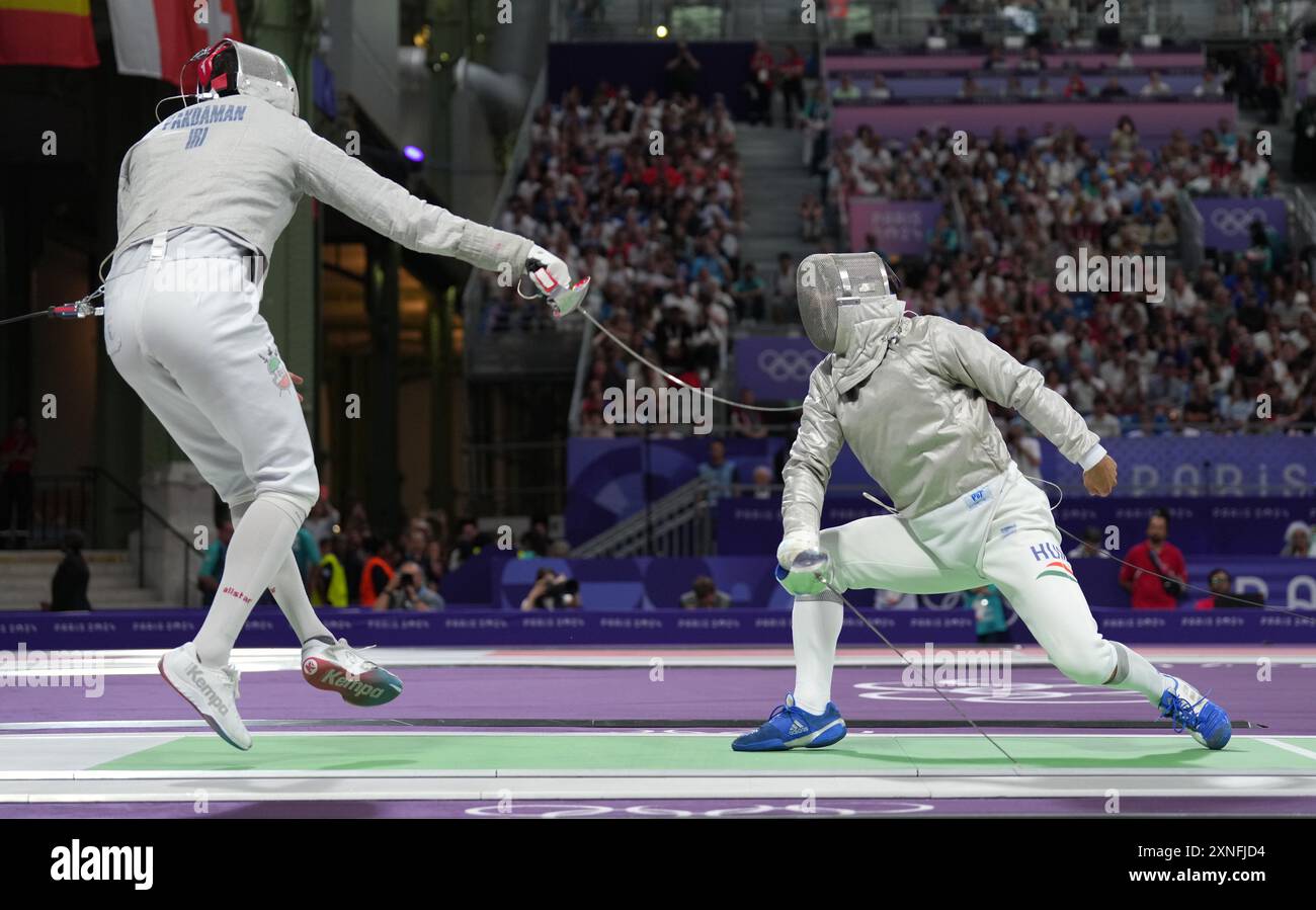 Paris, France. 31st July, 2024. Ali Pakdaman (L) of Iran competes with ...