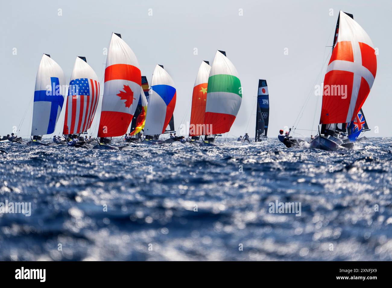 Sailors from around the world compete use spinnaker sails with their ...