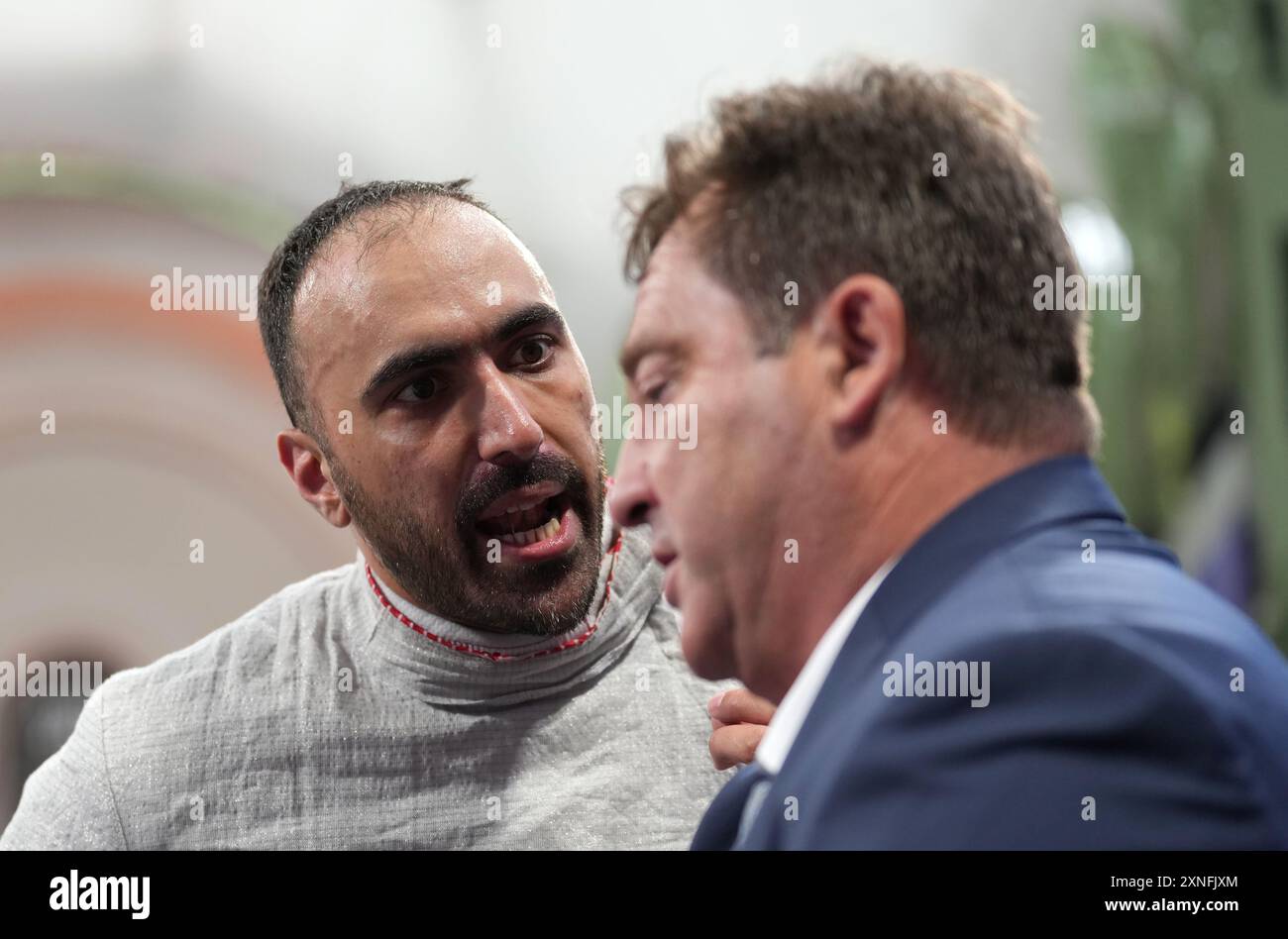 Paris, France. 31st July, 2024. Ali Pakdaman (L) of Iran argues with ...
