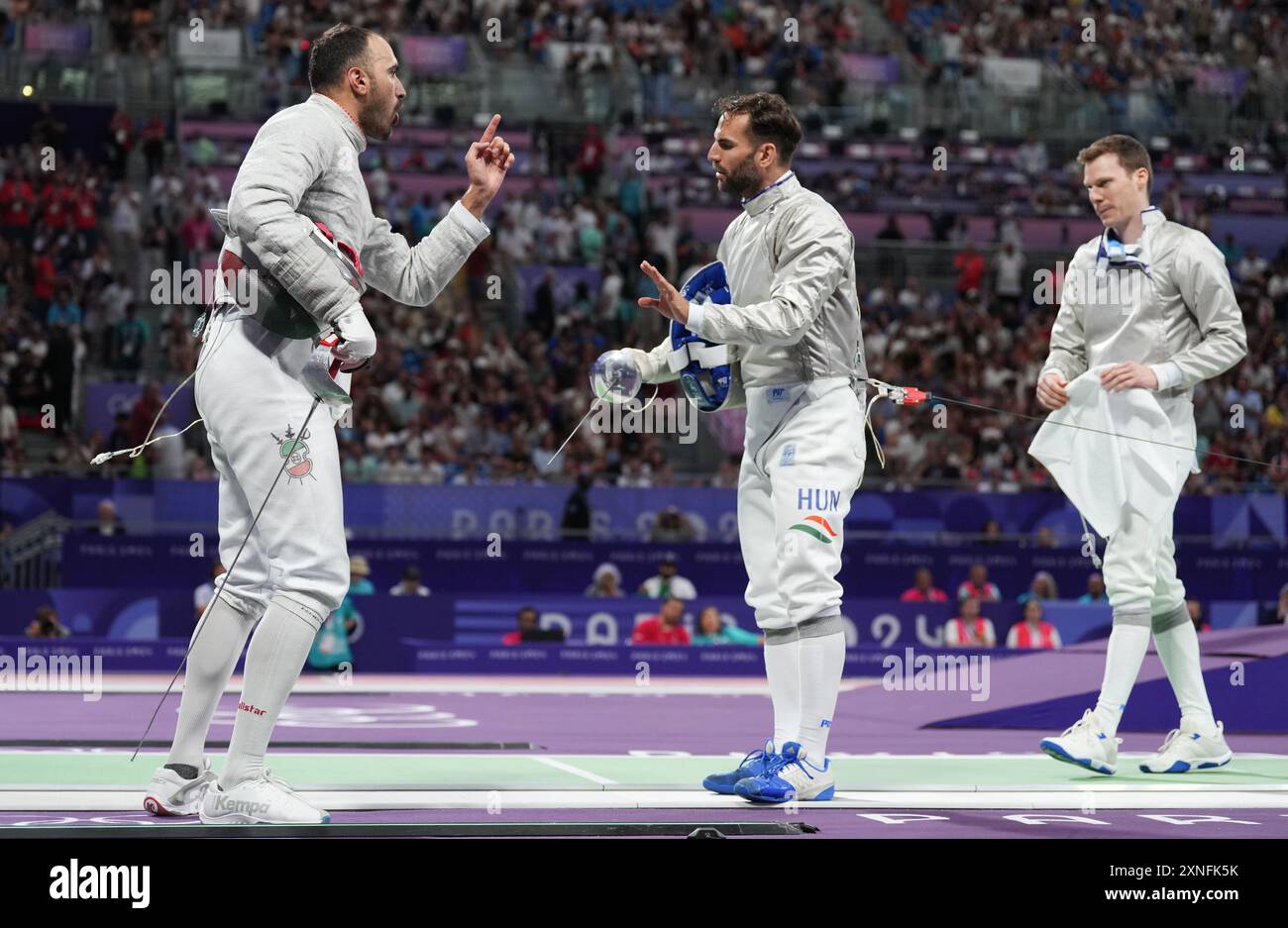 Paris, France. 31st July, 2024. Ali Pakdaman (L) of Iran argues with ...