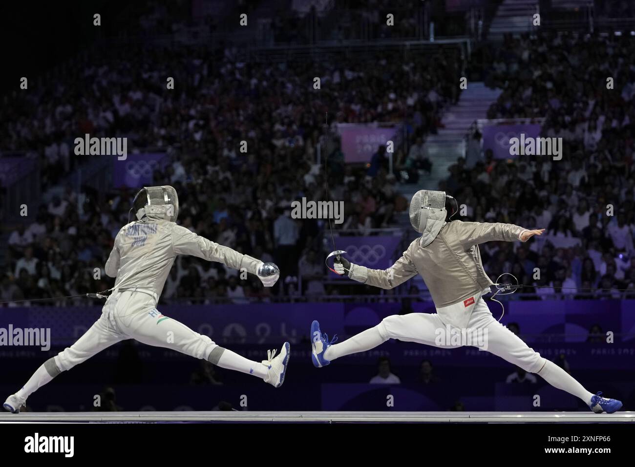 Hungary's Andras Szatmari, left, competes with South Korea's Gu Bongil ...