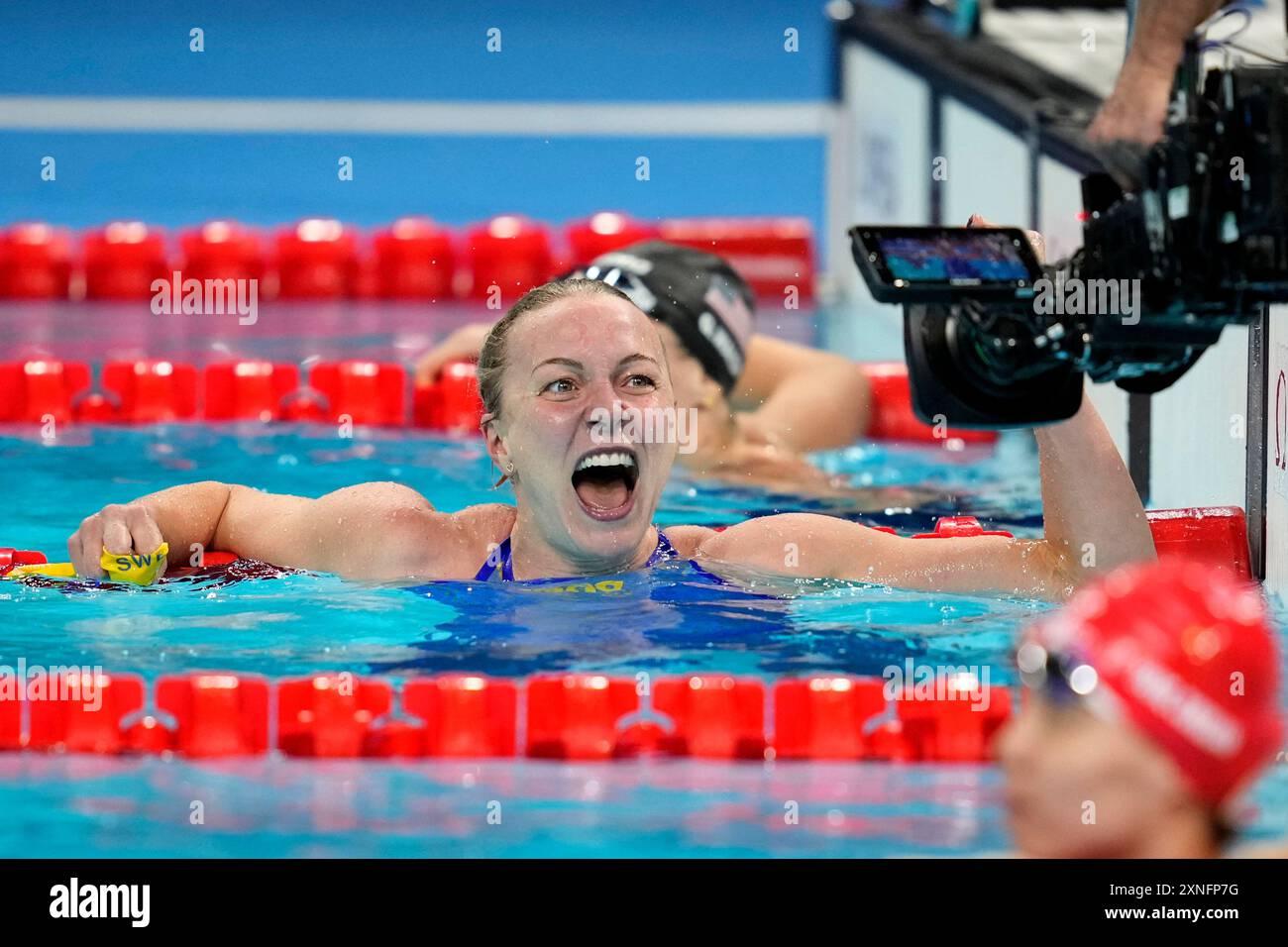 Sarah Sjoestroem of Sweden, celebrates after winning the women's 100 ...