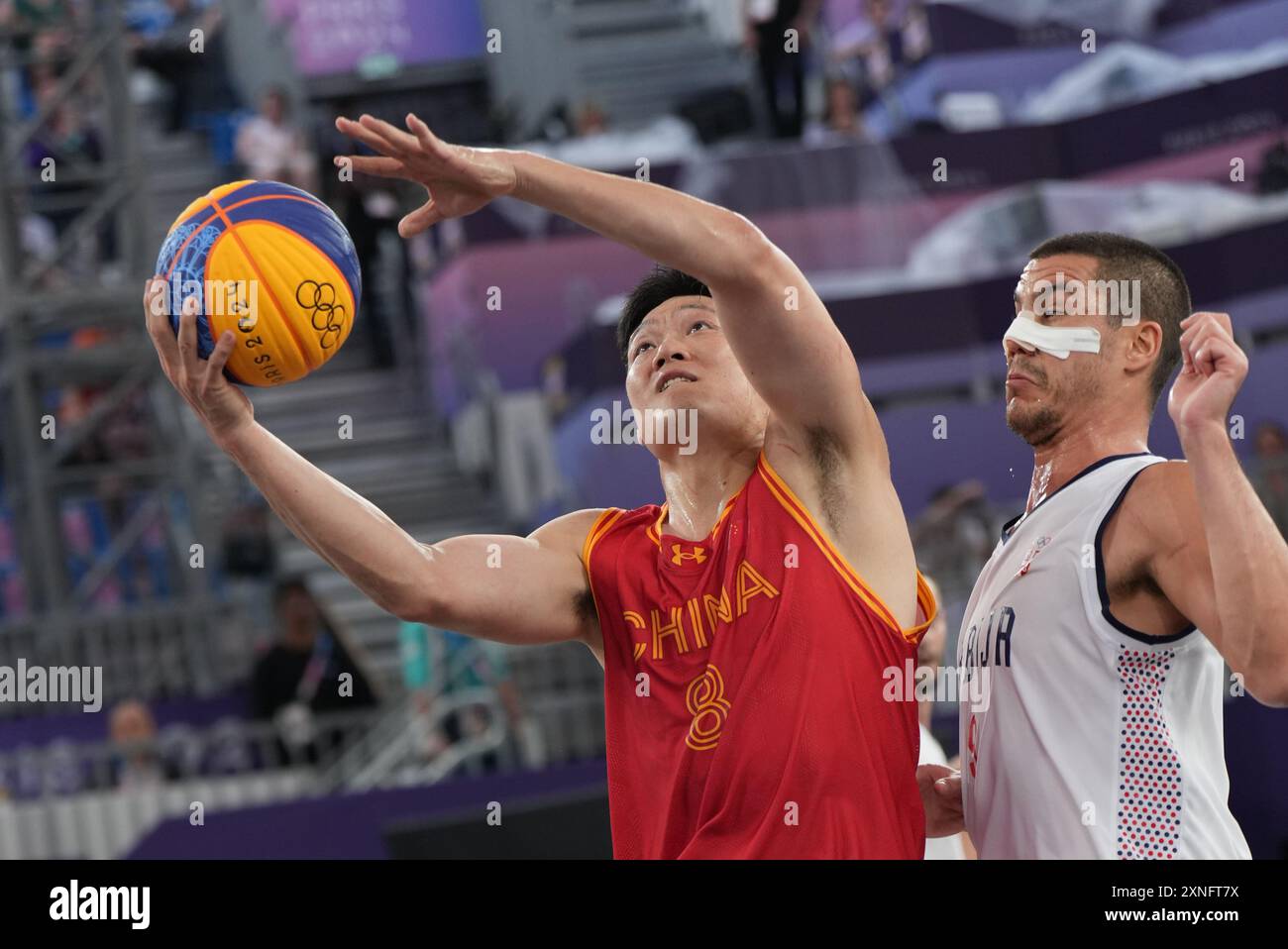 Paris, France. 31st July, 2024. Zhang Ning (L) of China attempts a layup during the 3x3 ...