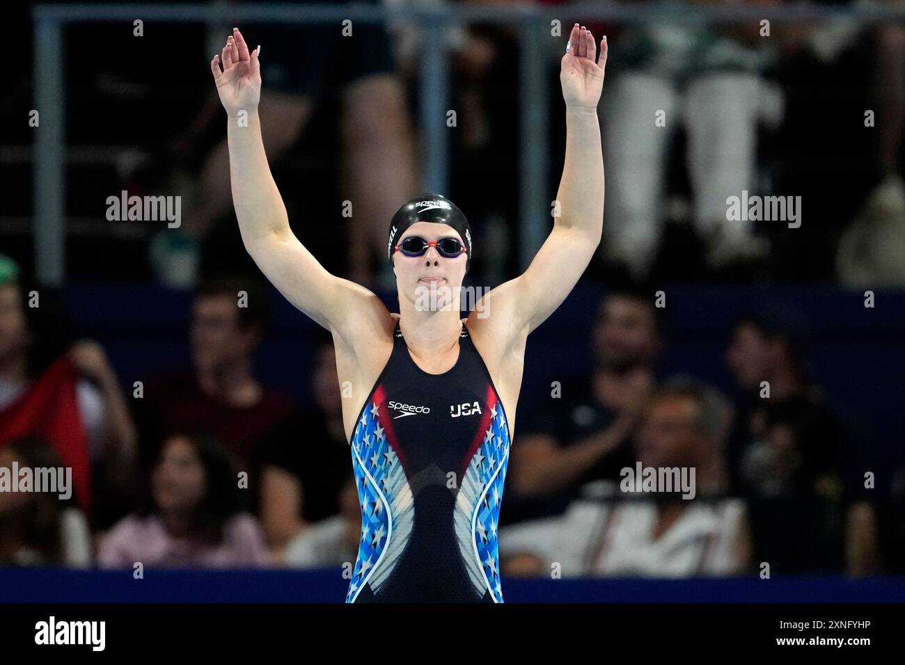 Alex Shackell, of the United States, stretches ahead of her women's 200 ...