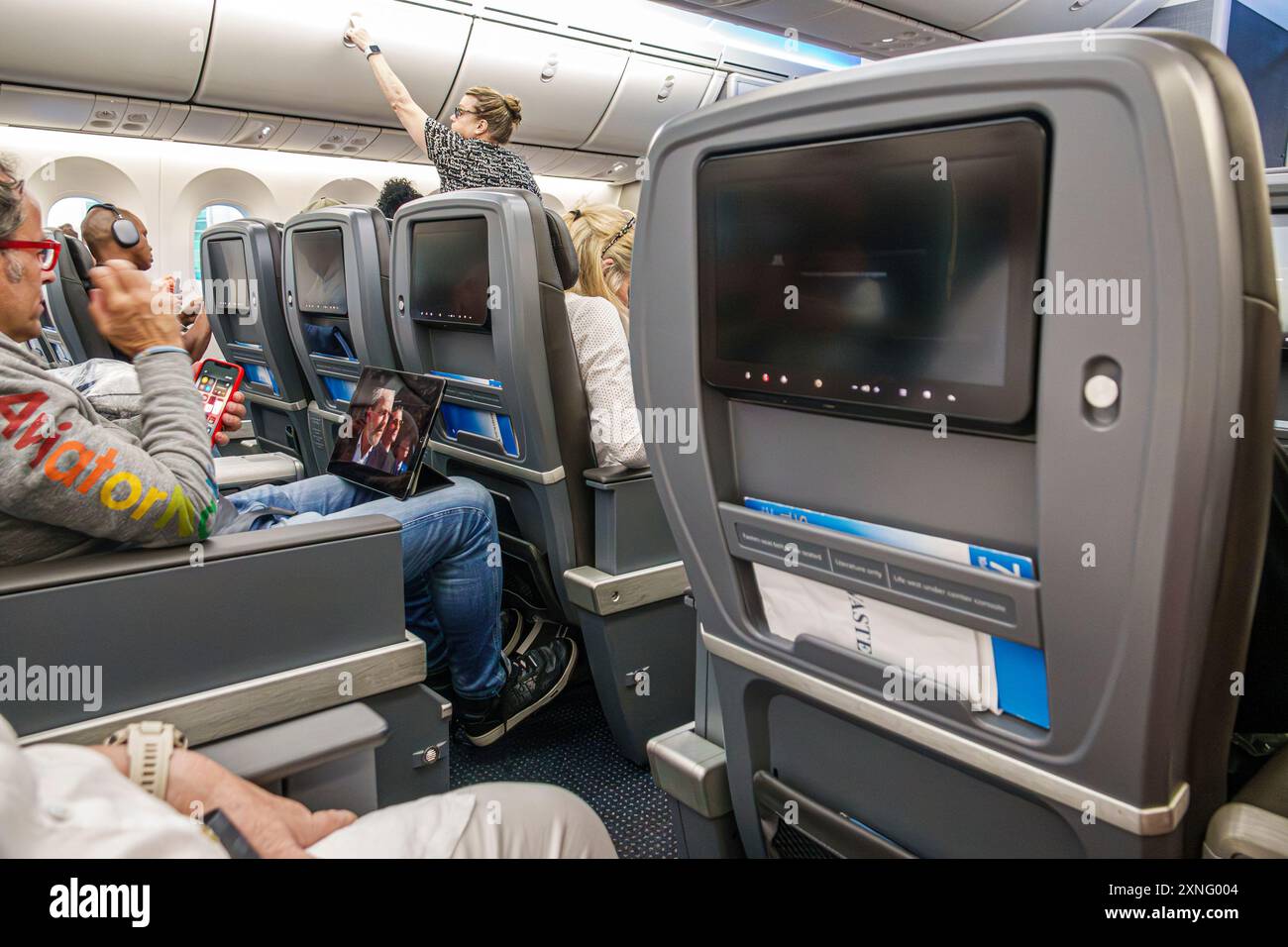 Inside interior premium economy seats onboard cabin hi-res stock ...