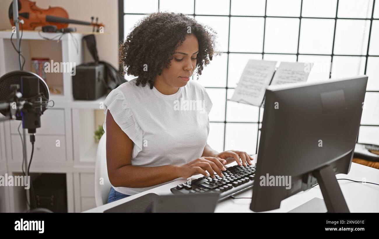 African american woman producing music in a studio Stock Photo - Alamy