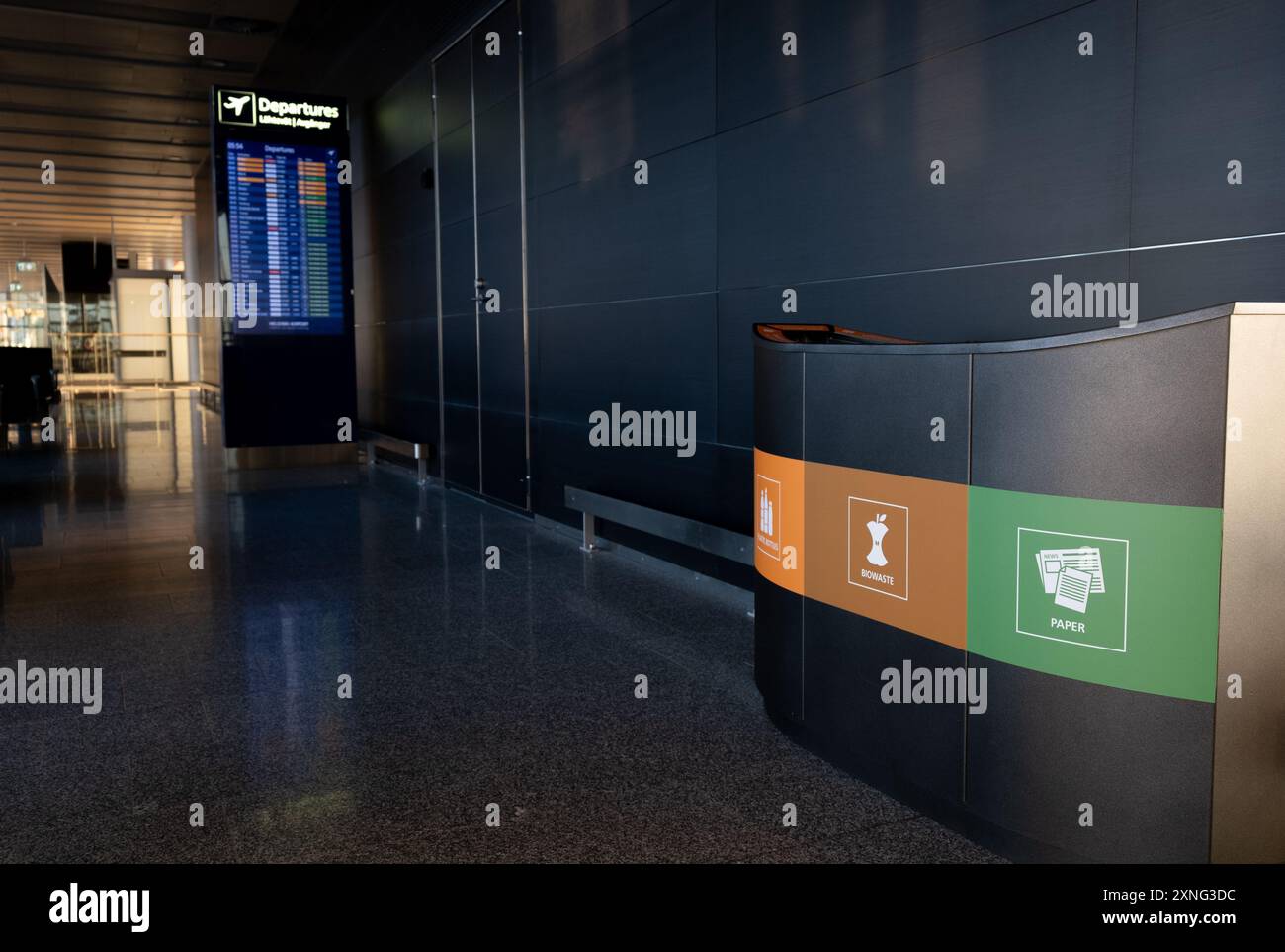 Modern trash bins for waste segregation at airport terminal. Management ...