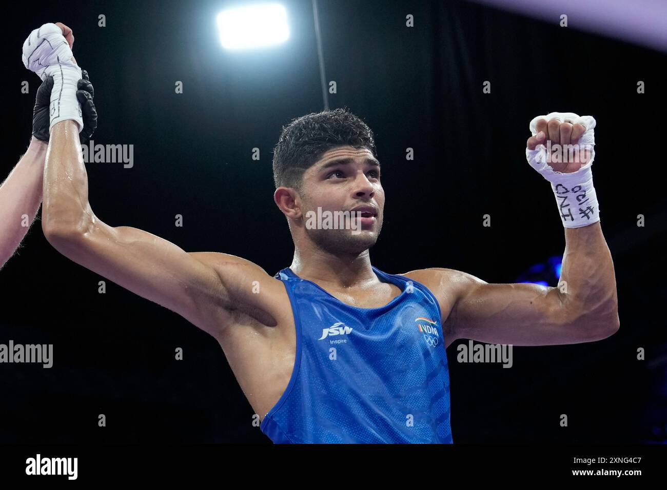 India's Nishant Dev celebrates after defeating Ecuador's Jose Rodriguez ...