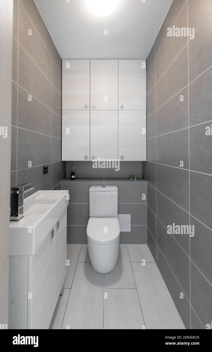 Tiny WC Lavatory Toilet Home Interior. Sinket and Faucet in Foreground ...