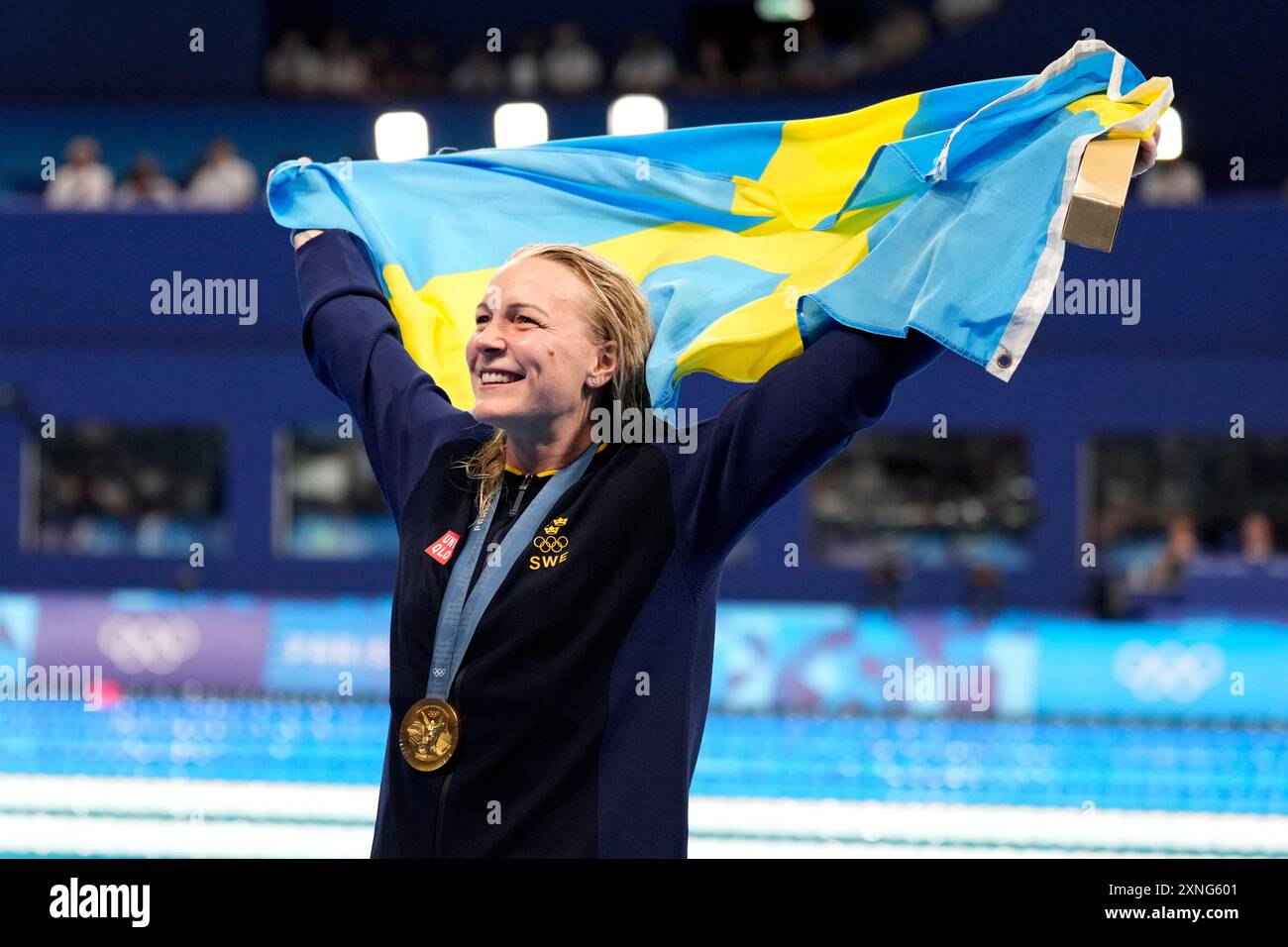 Gold medalist Sarah Sjoestroem, of Sweden, poses after the women's 100 ...