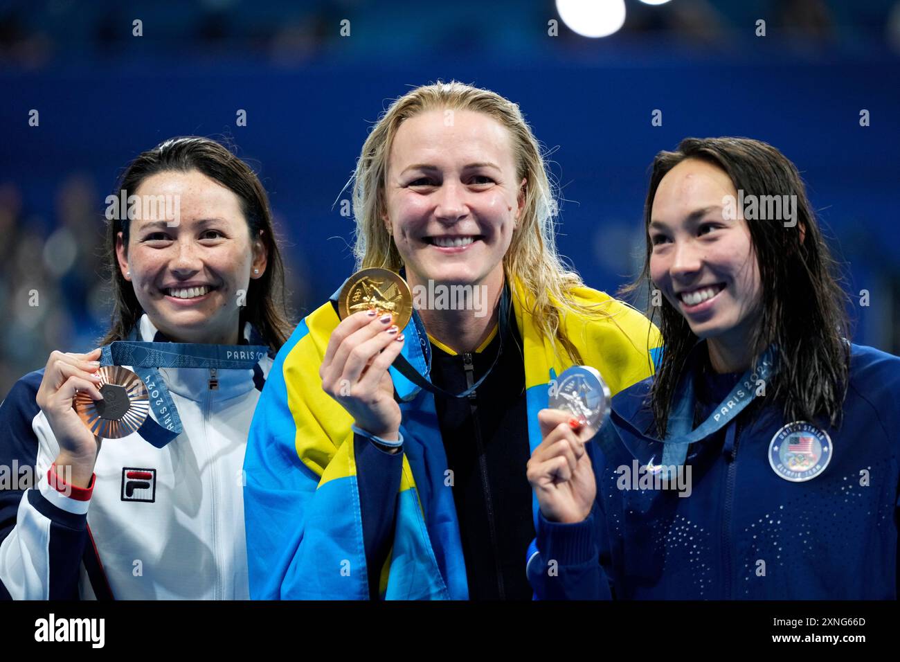 Gold medalist Sarah Sjoestroem, of Sweden, stands with silver medalist ...