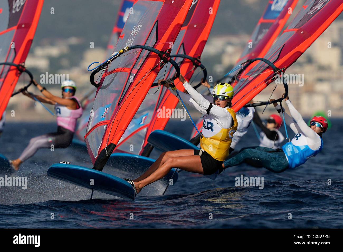 Emma Wilson of Britain leads the women's iQFOiL windsurfing class fleet ...