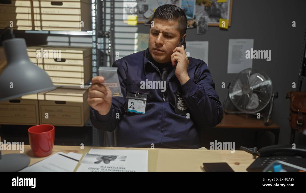 Hispanic detective examines evidence in a cluttered police station ...