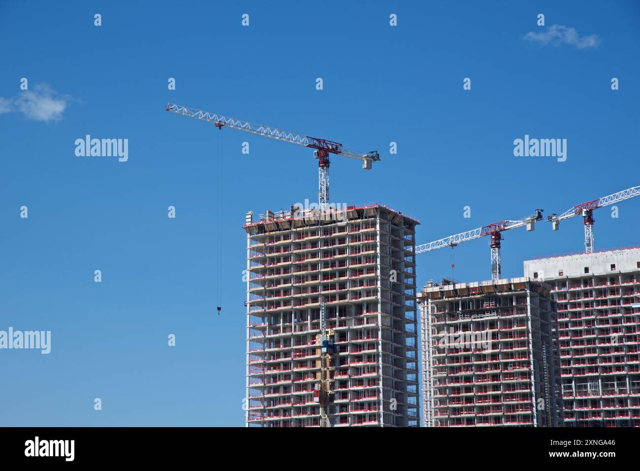 New apartment construction site with cranes and buildings Stock Photo ...