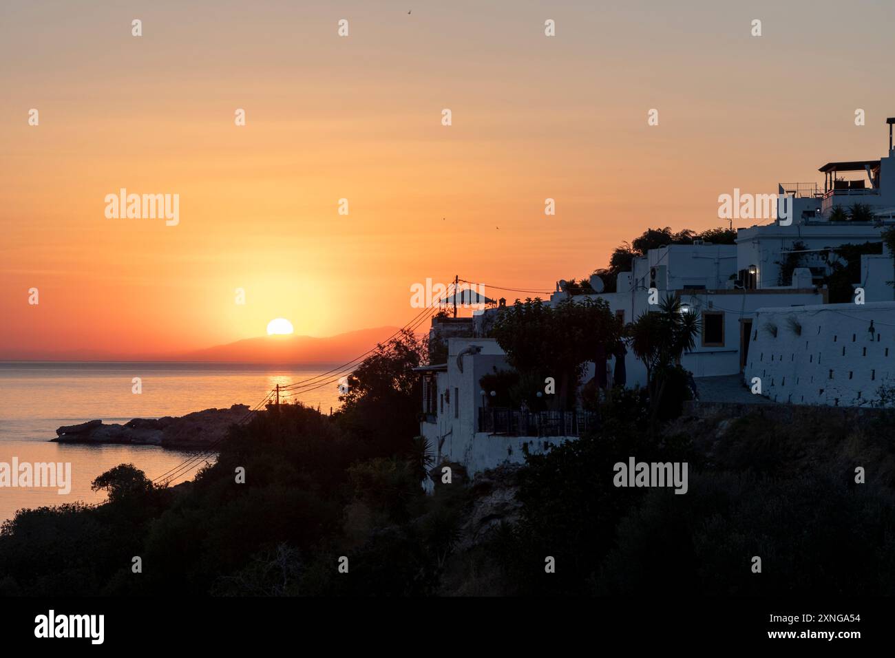 A Sunset Sky over Lindos, on the Greek island of Rhodes Stock Photo - Alamy
