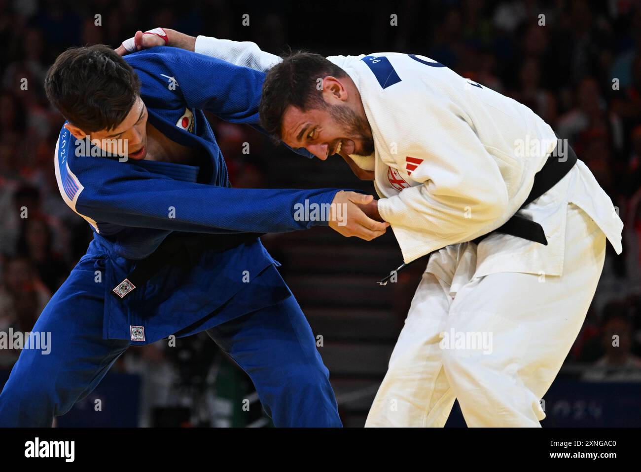 Paris, France. 31st July, 2024. Lasha Bekauri (white) of Georgia ...