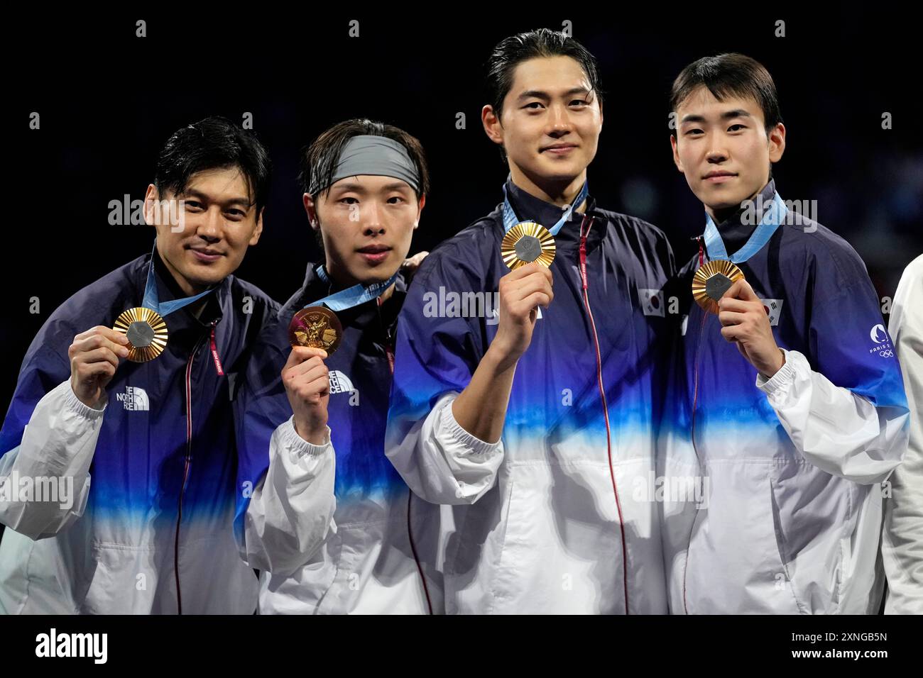 South Korea's fencers Oh Sanguk, Gu Bongil, Park Sangwon and Do Gyeongdong celebrate on the ...