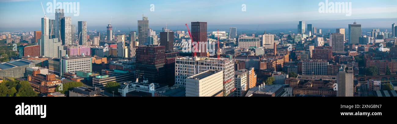 Aerial view of Manchester cityscape with skyscrapers and construction ...