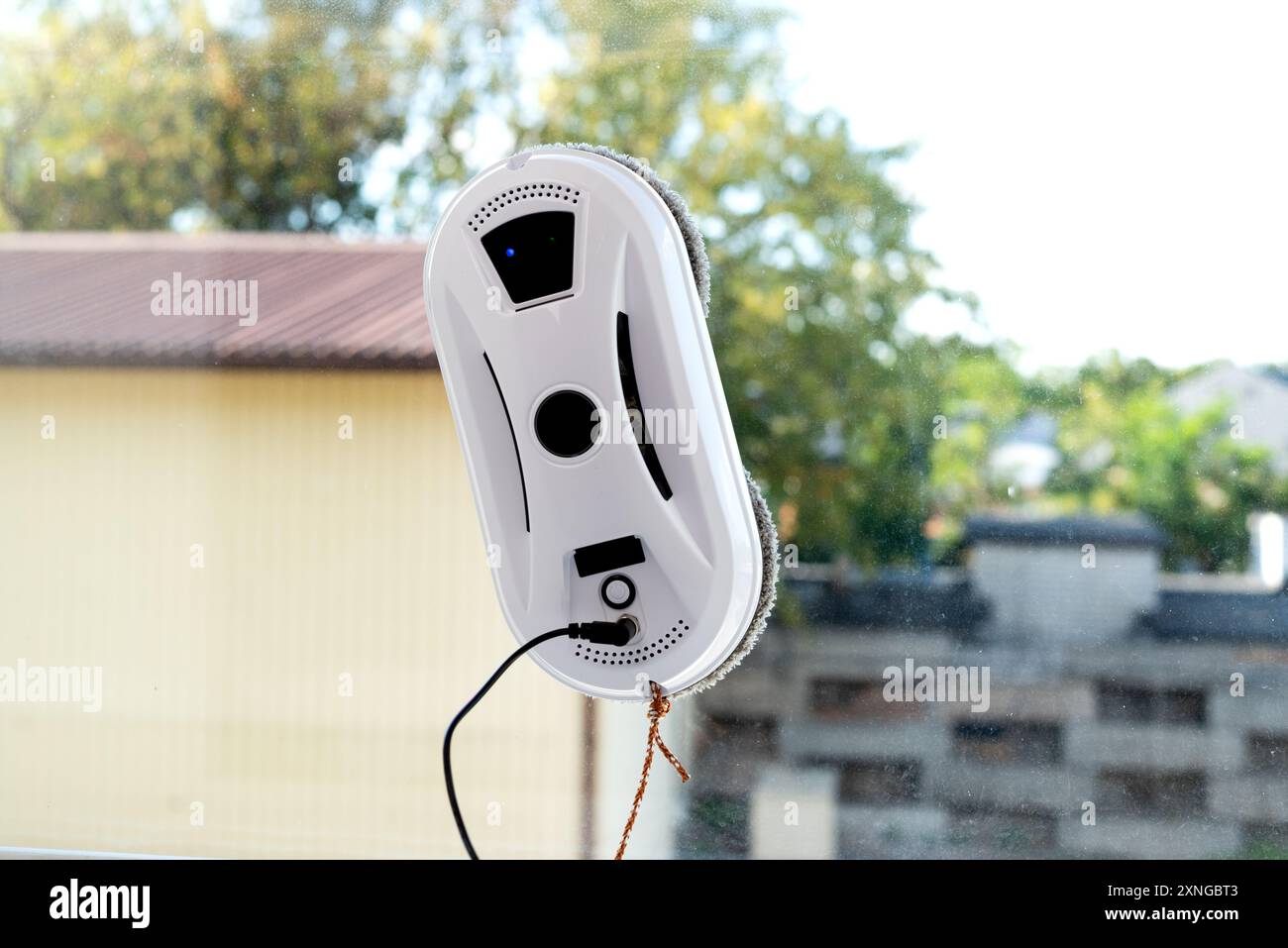 Modern device for cleaning glass from dirt and streaks. Robot washer ...