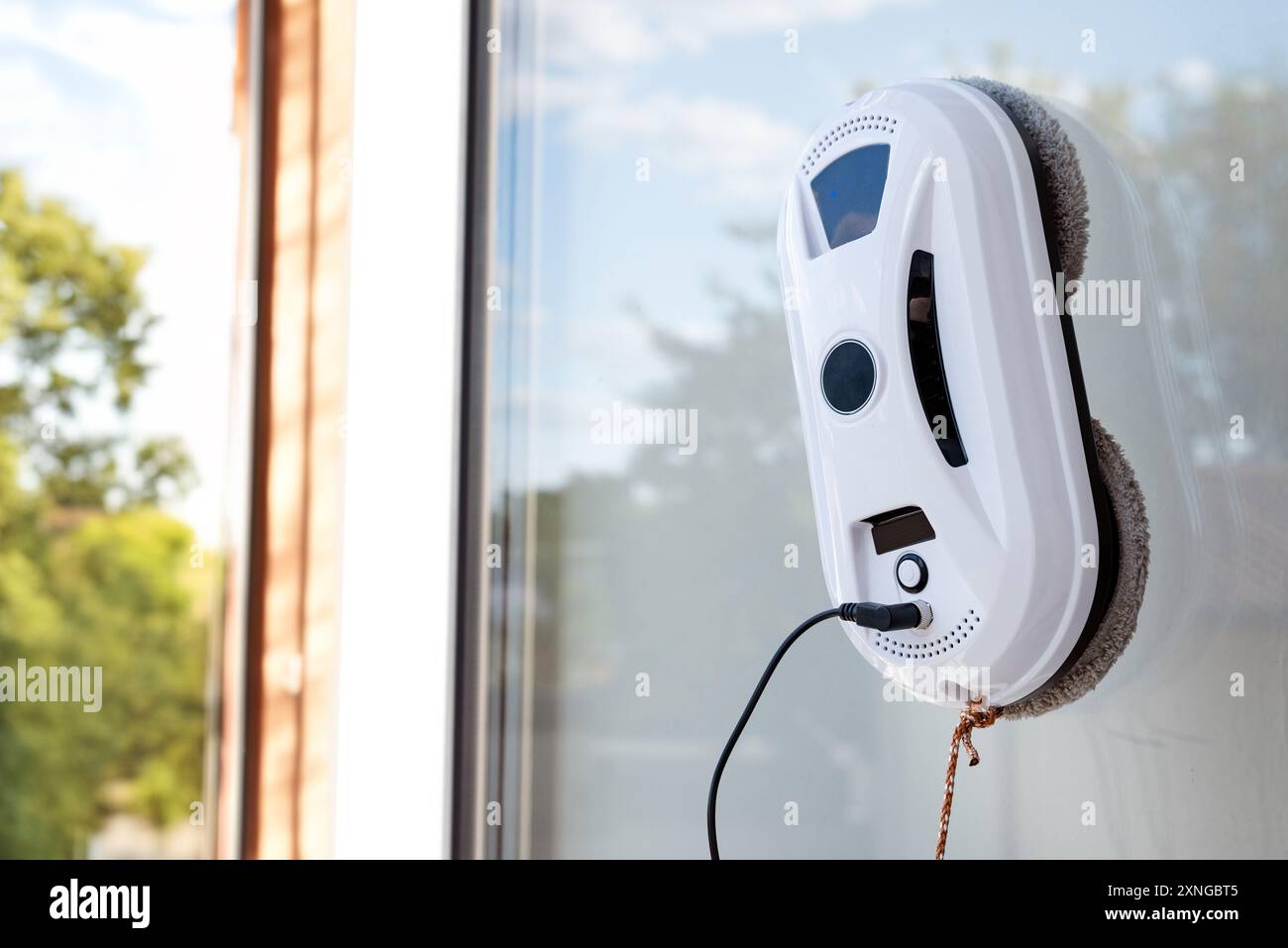 Modern device for cleaning glass from dirt and streaks. Robot washer ...