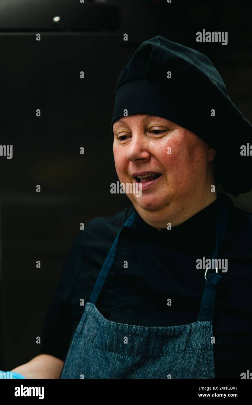 Woman baker in blue hi-res stock photography and images - Alamy