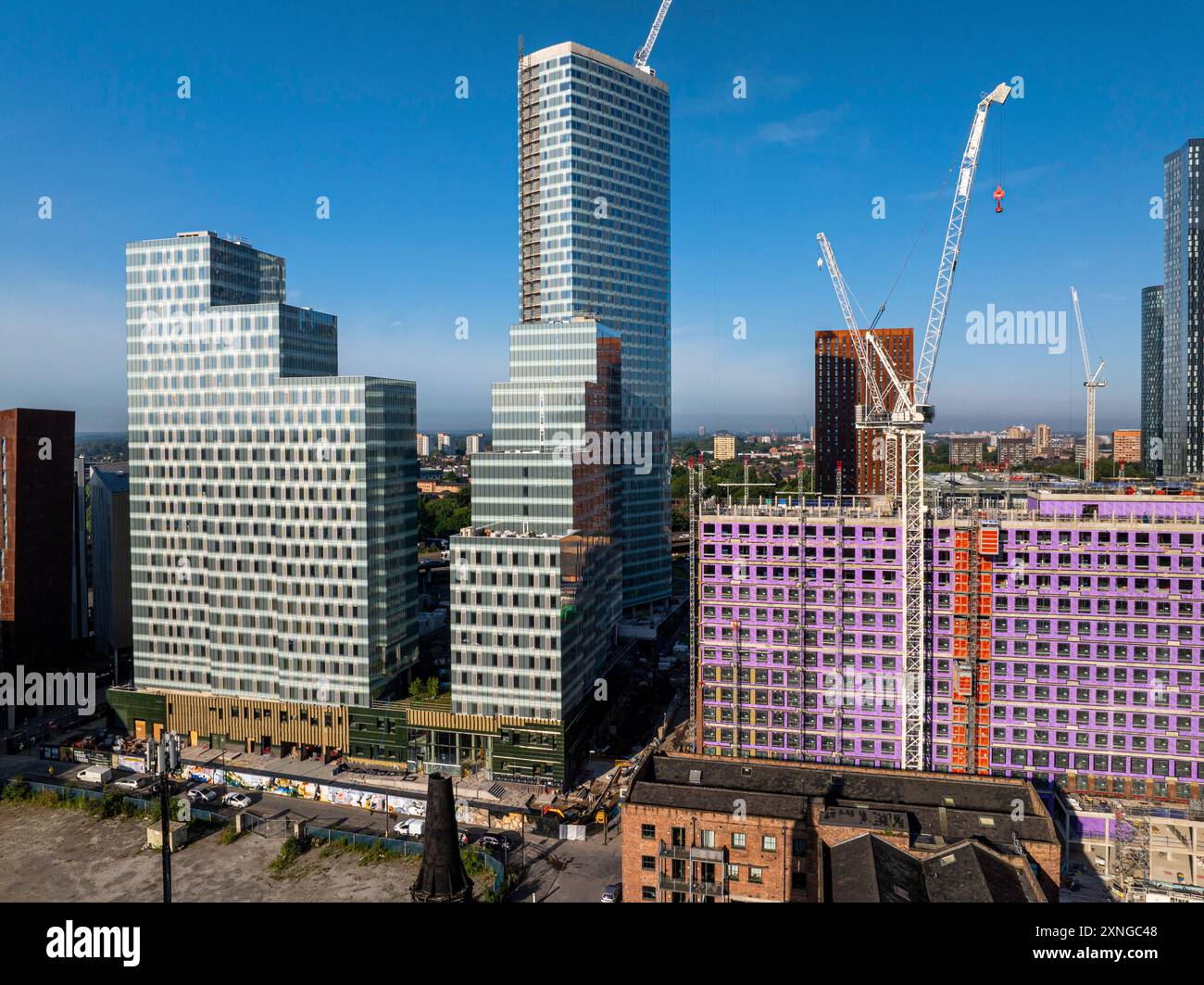 Aerial view of a bustling Manchester Skyline with skyscrapers under ...