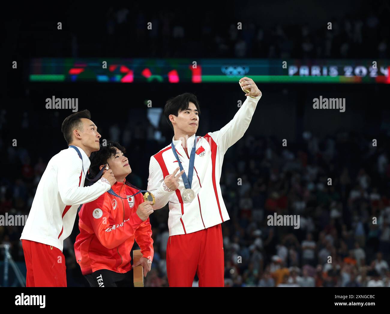 Paris, France. 31st July, 2024. Gold medalist Oka Shinnosuke (C) of Japan, silver medalist Zhang ...