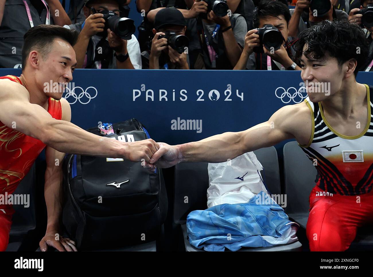 Paris, France. 31st July, 2024. Oka Shinnosuke (R) of Japan shakes hands with Xiao Ruoteng of ...