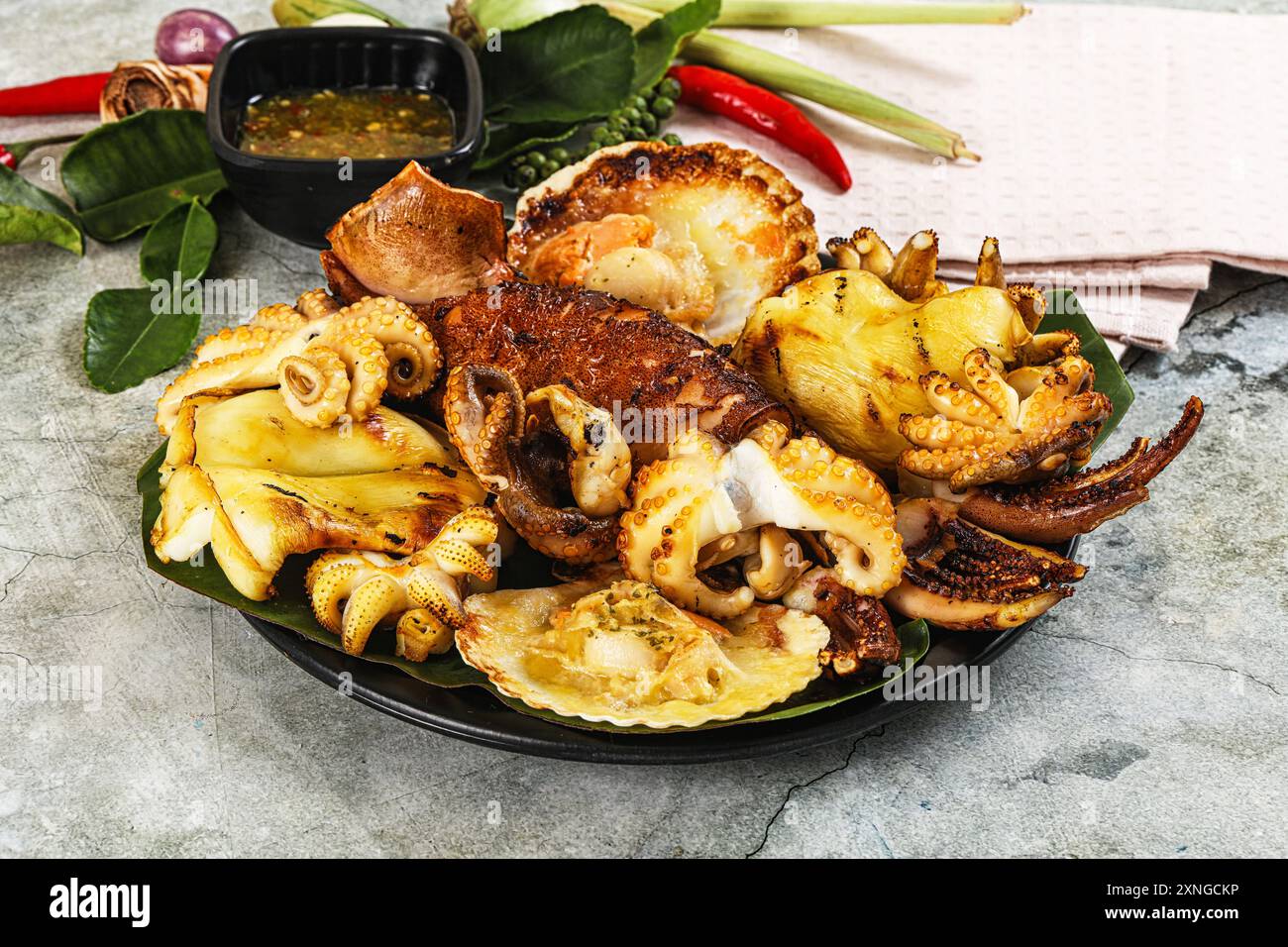 Asian grilled seafood mix plate - squid, cuttlefish, scallops and ...