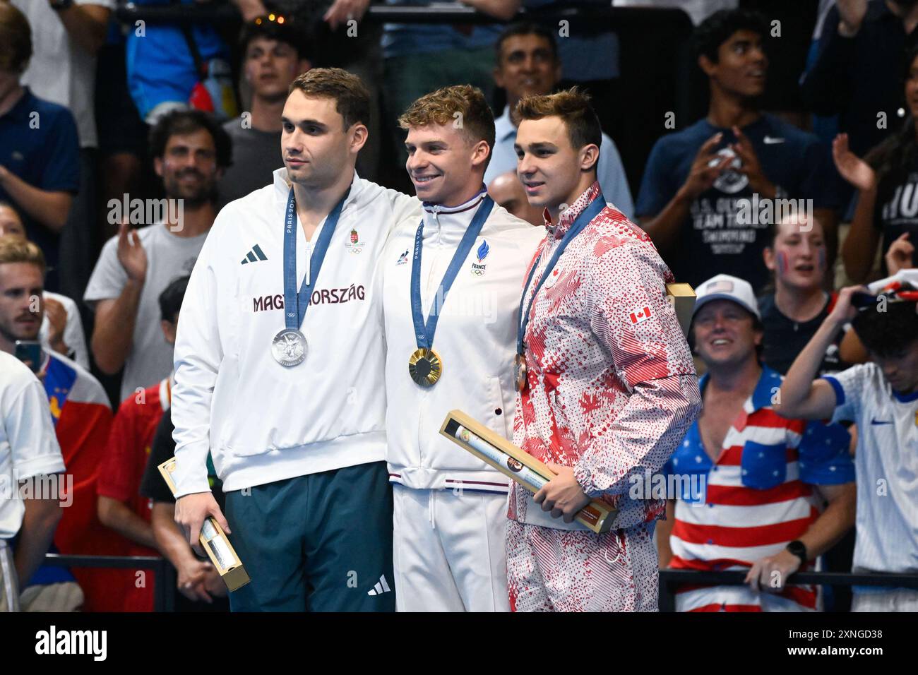 Kristof Milak ( HUN ) Silver medal, Leon Marchand ( FRA ) Gold medal, Ilya Kharun CAN ) Bronze ...