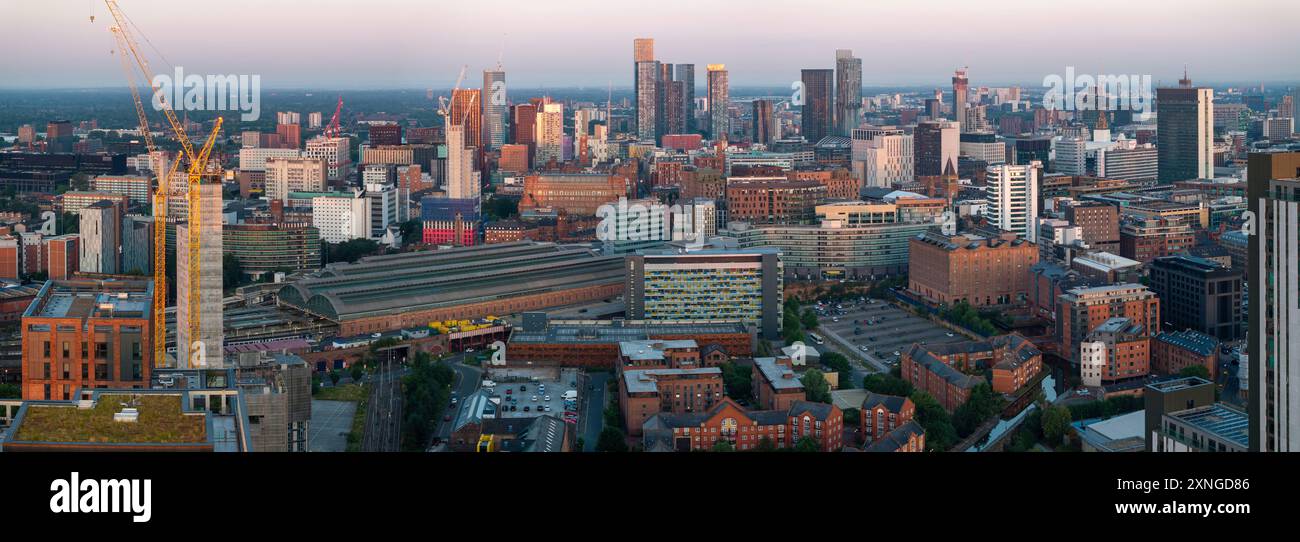 Aerial view of Manchester cityscape with skyscrapers and construction ...