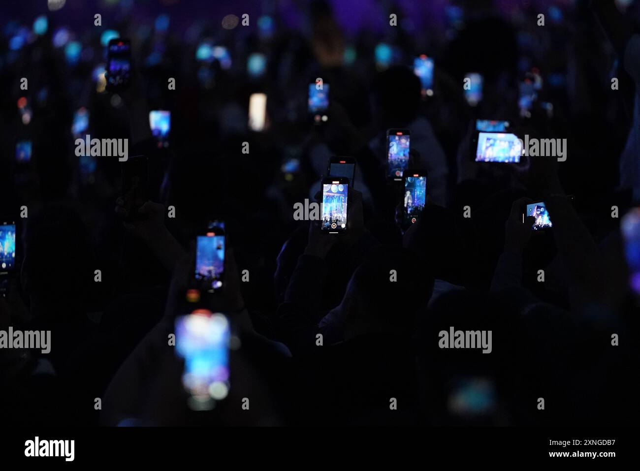 People are watching a concert with mobile phones Stock Photo - Alamy