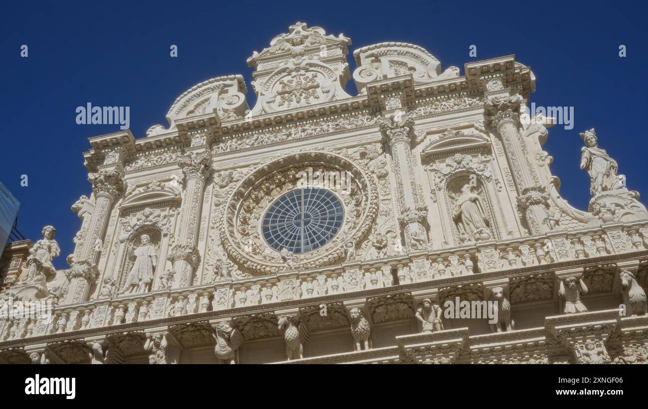 Ornate architecture with intricate sculptures and a large round window ...