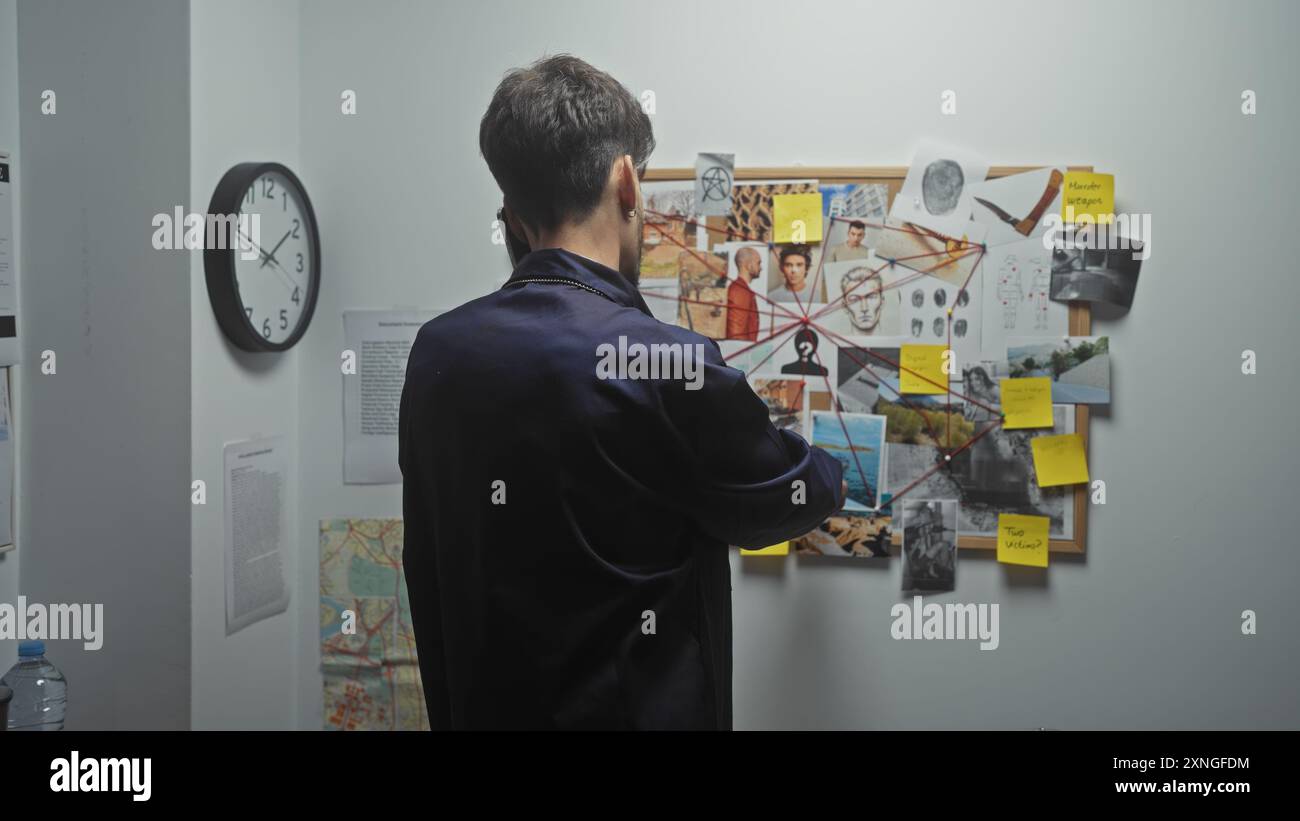 Young hispanic man in detective office analyzing crime investigation ...