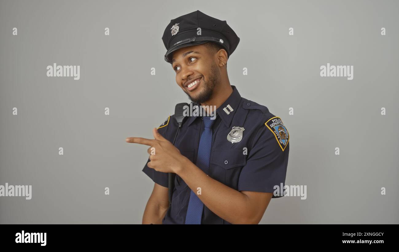 Police officer pointing smiling hi-res stock photography and images - Alamy