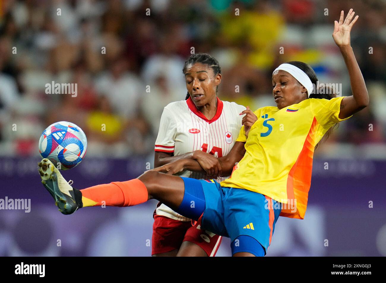 Canada's Ashley Lawrence, left, and Colombia's Yirleidys Quejada Minota ...