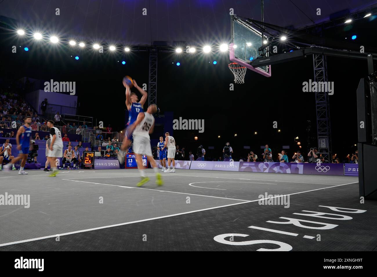 France's Jules Rambaut jumps defended by Lithuania's Evaldes Dziaugys ...