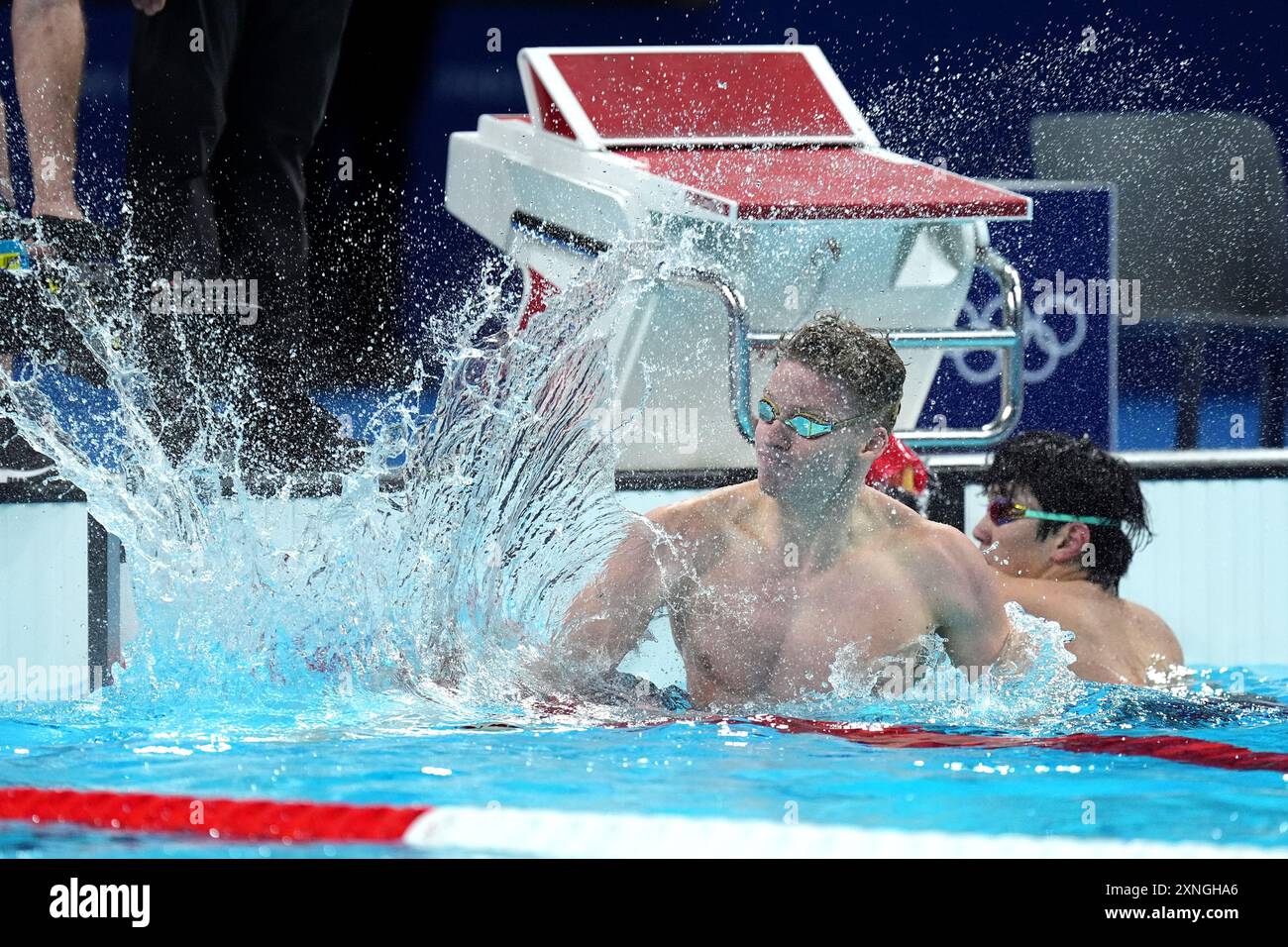 France's Leon Marchand celebrates after winning the men's 200m ...