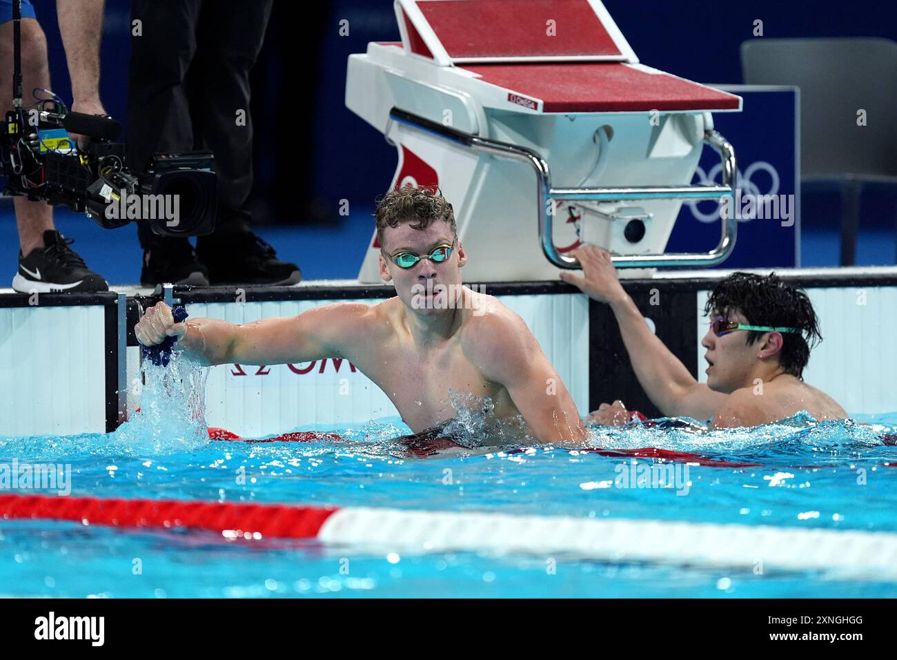 France's Leon Marchand celebrates after winning the men's 200m ...
