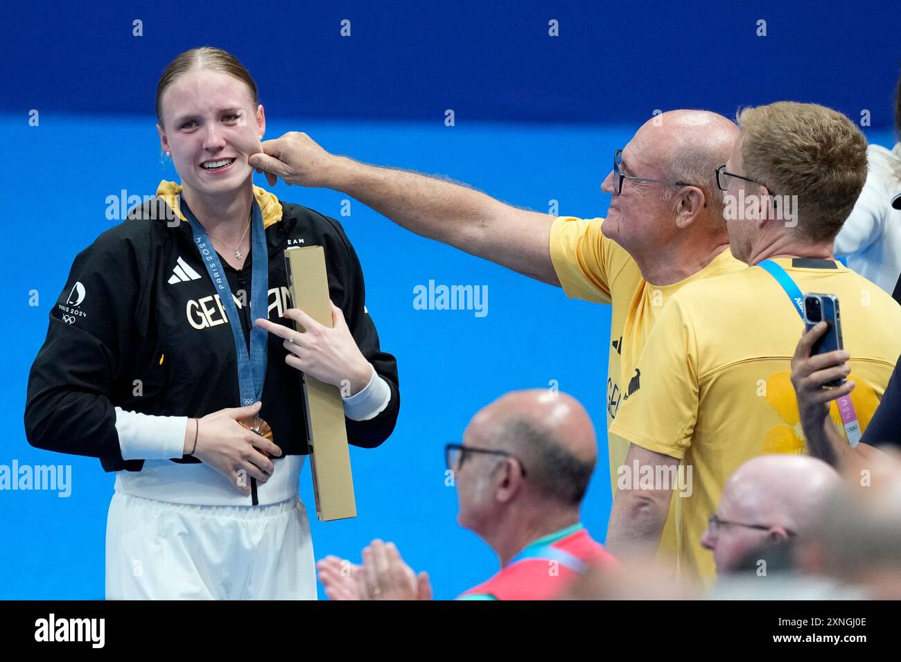 Bronze medalist Isabel Gose, of Germany, is greeted by a fan after the ...