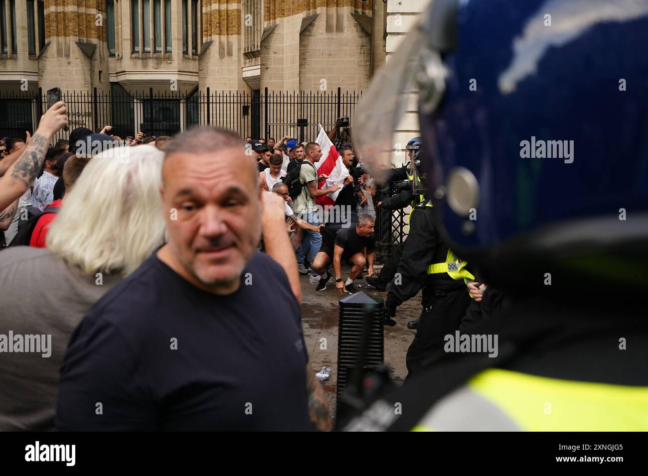 Police officers scuffle with people attending the 'Enough is Enough ...
