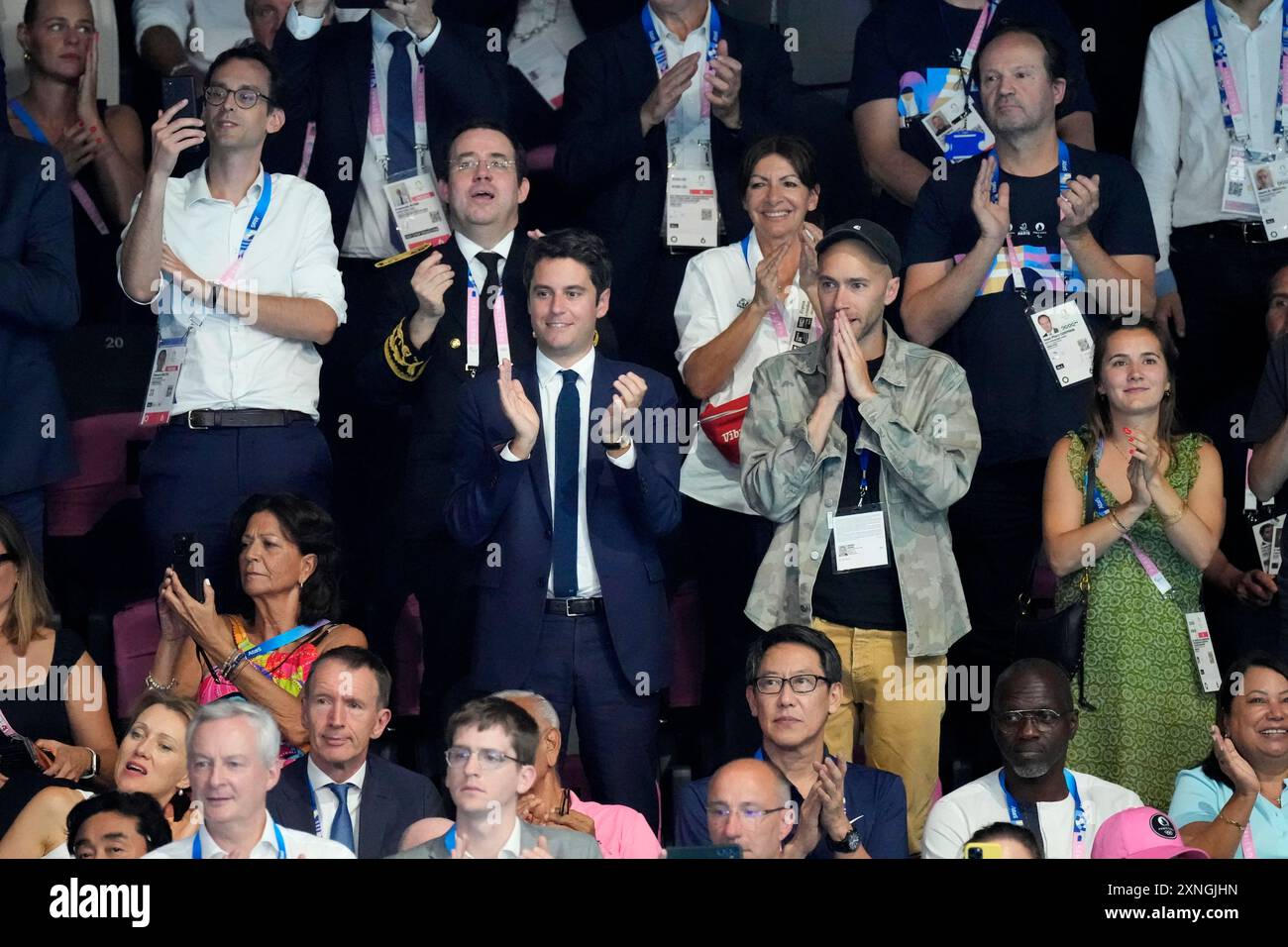 France's Prime Minister Gabriel Attal cheers during a swimming session ...