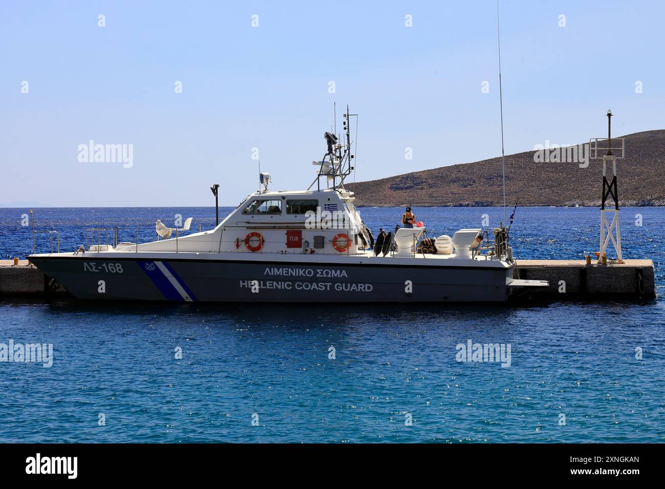 Livadia harbour with Hellenic Coast Guard boat moored, Tilos Island ...