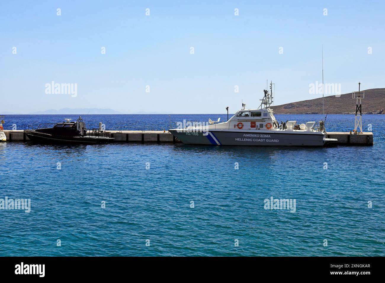 Livadia harbour with Hellenic Coast Guard boat moored, Tilos Island ...