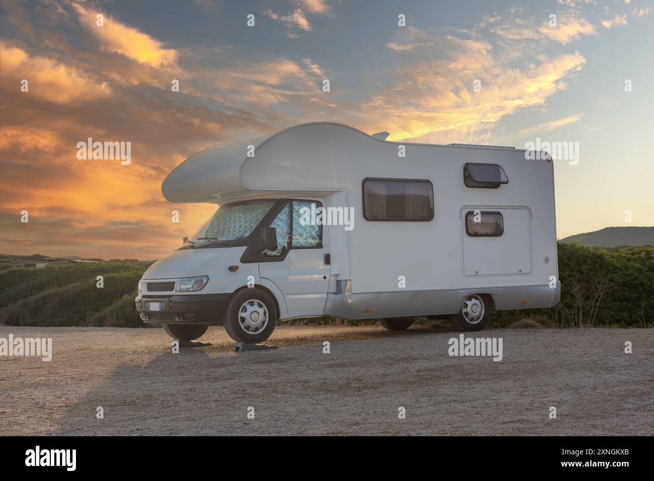 Camper Van at Sunset with Dramatic Sky Stock Photo - Alamy