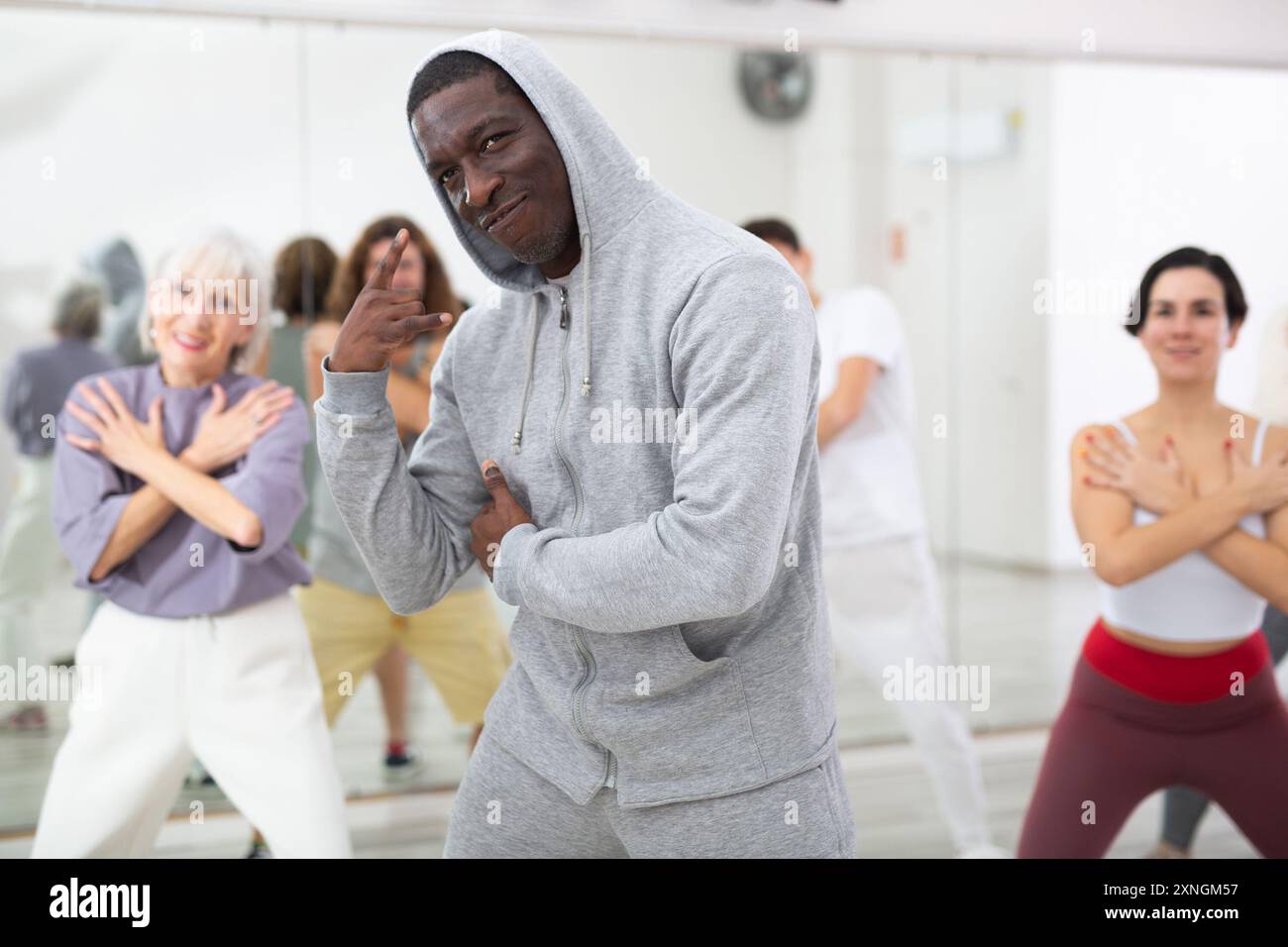 Group of multinational people practicing new modern dance techniques ...